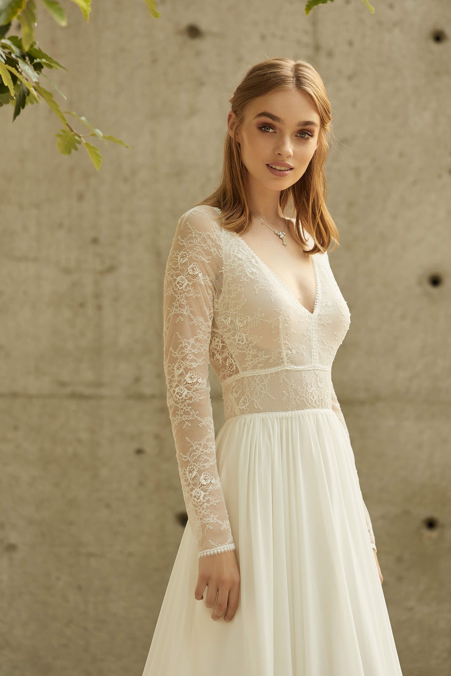 Explore long sleeved A-line dress with capped sleeves at Bride Now